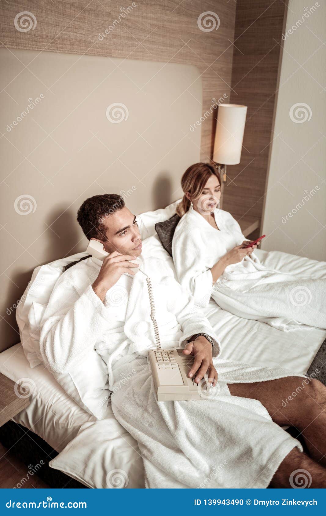 Husband Calling Room Service while Ordering Breakfast To Room Stock ...