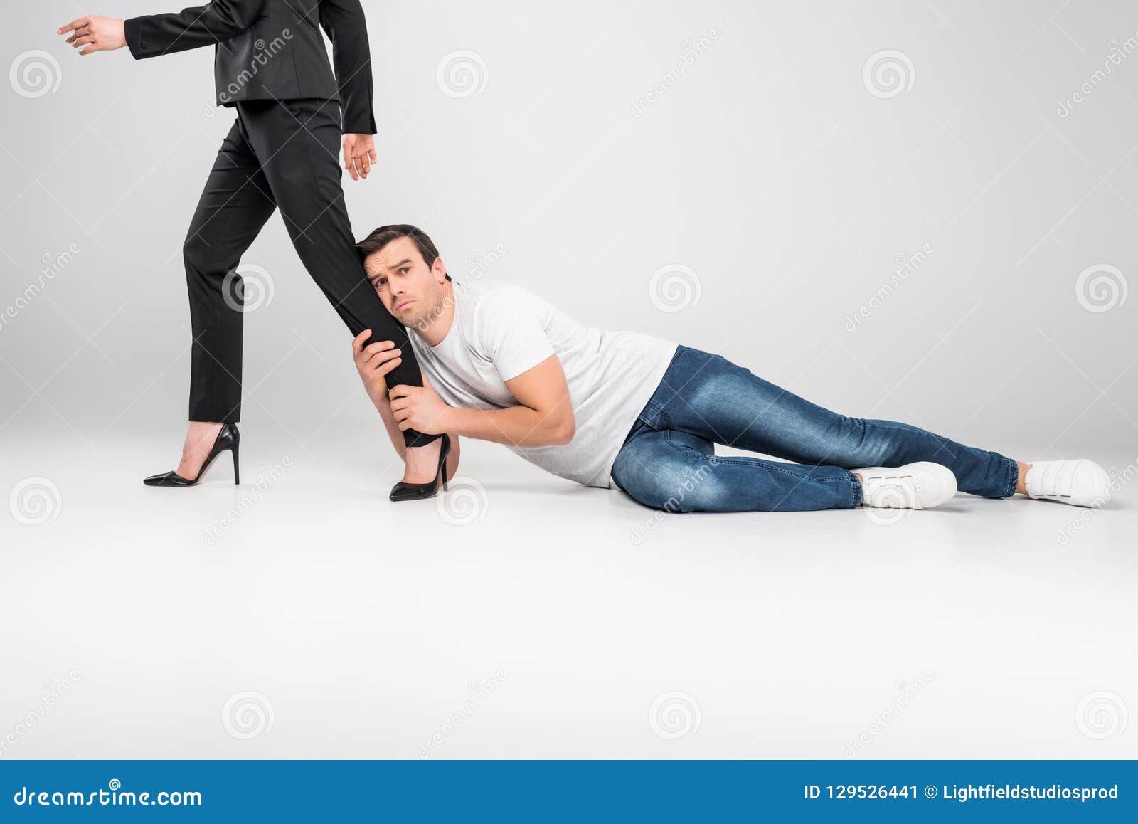 Husband Holding Leg Of His Business Wife Feminism Concept Stock Image