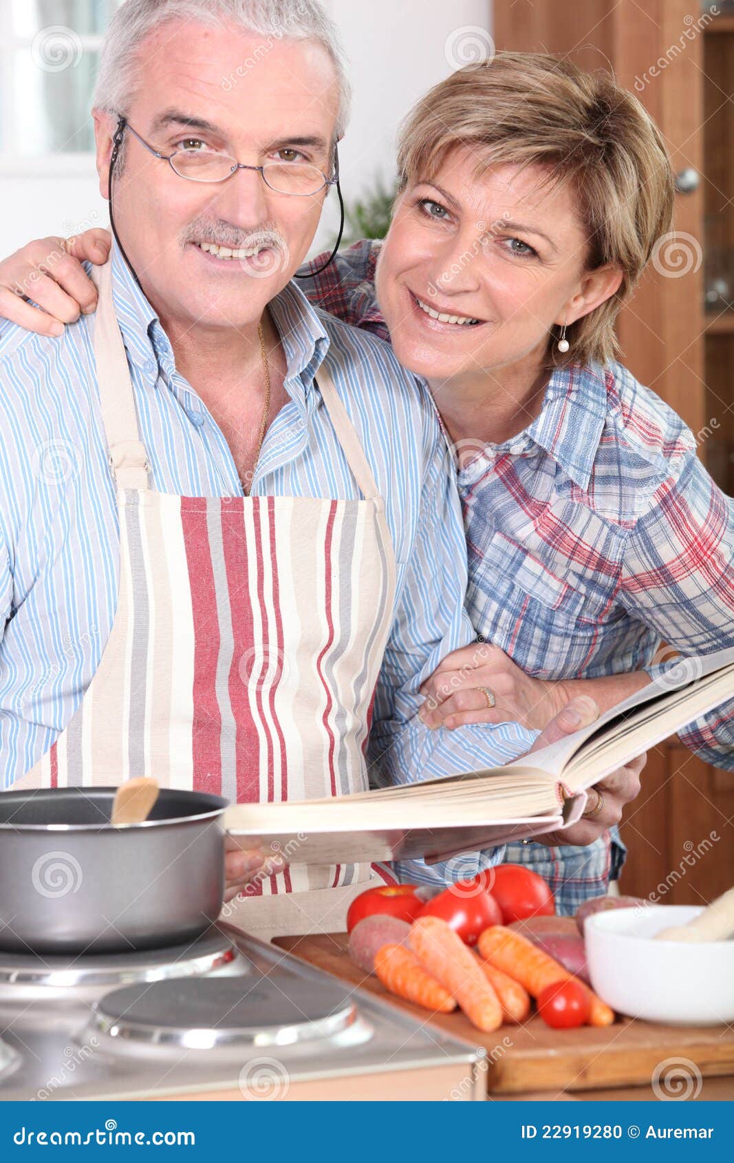 Husband Looking at a Cookbook Stock Photo - Image of caucasian, front ...