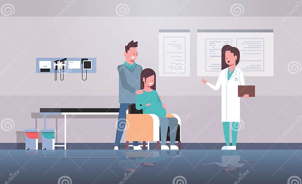 Husband With Pregnant Wife Visiting Female Doctor Gynecologist