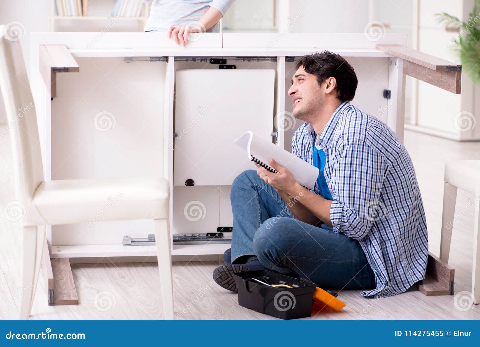 The Husband Repairing Broken Table at Home Stock Image - Image of ...