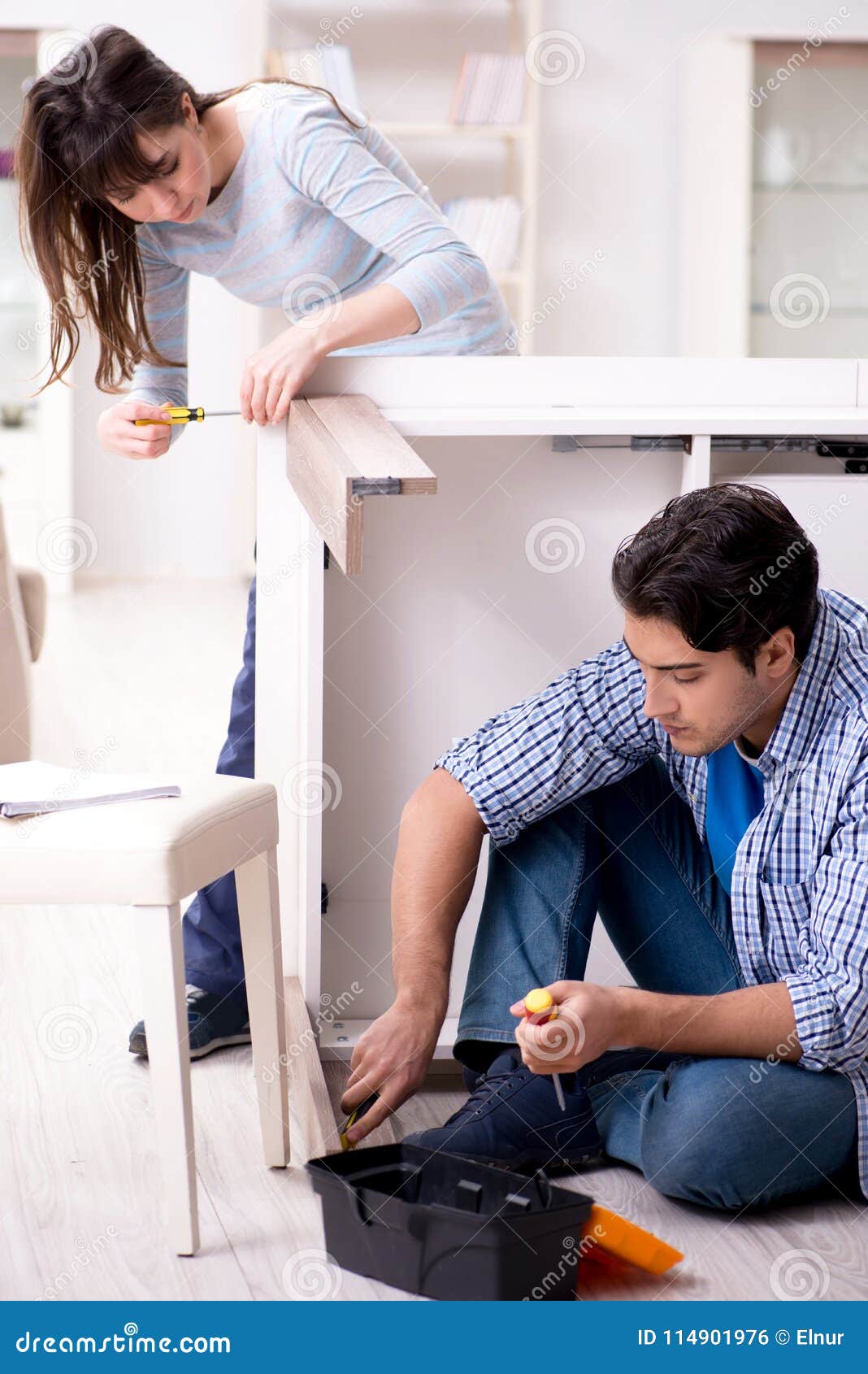 The Husband Repairing Broken Table at Home Stock Photo - Image of ...