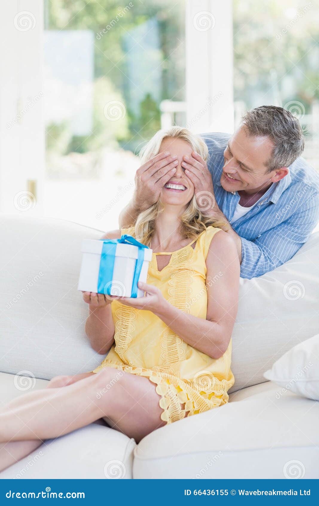 Husband Surprising Wife with a Present Stock Image - Image of eyes ...