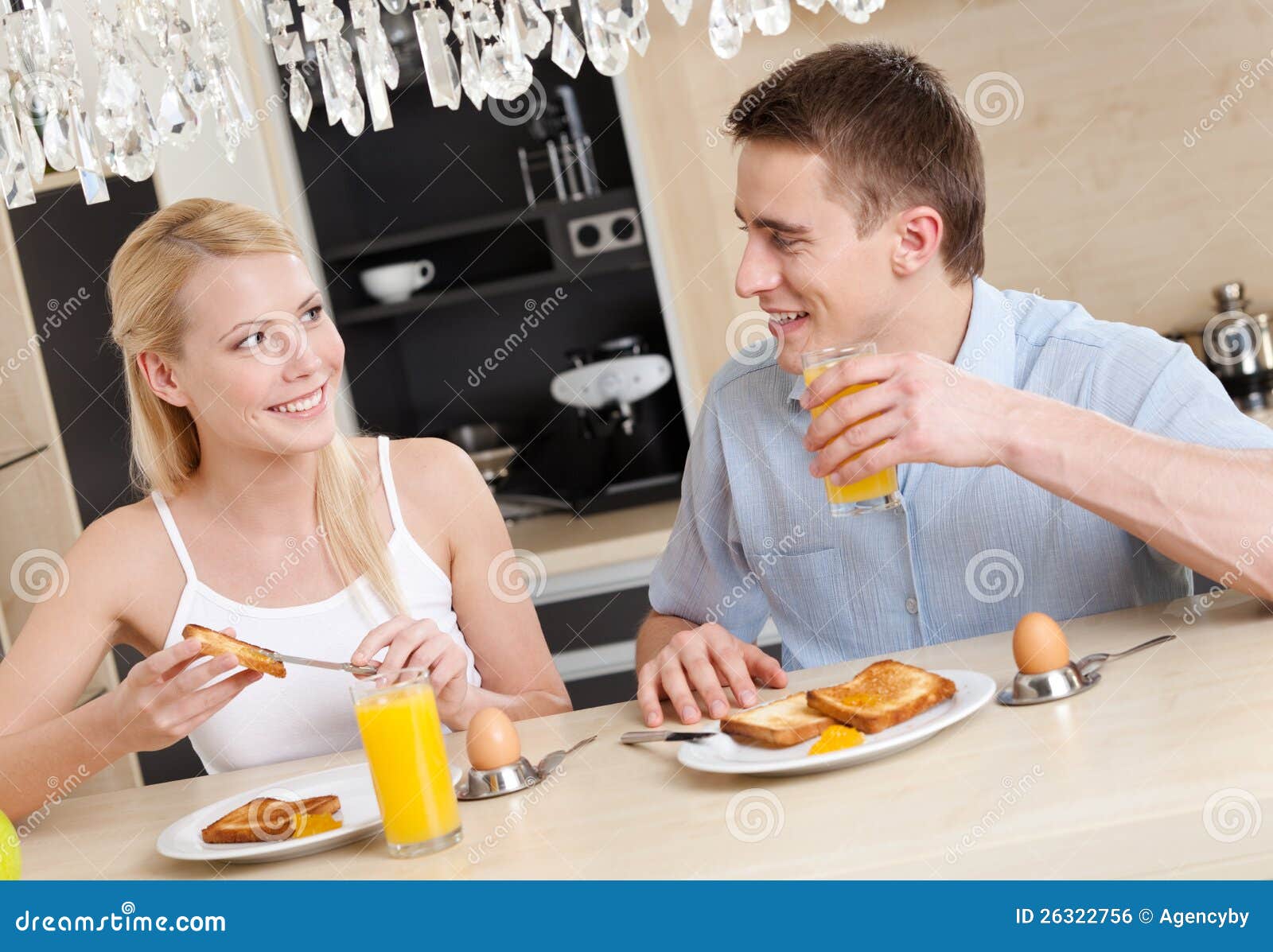 Husband and Wife Have a Snack in the Kitchen Stock Photo - Image of ...