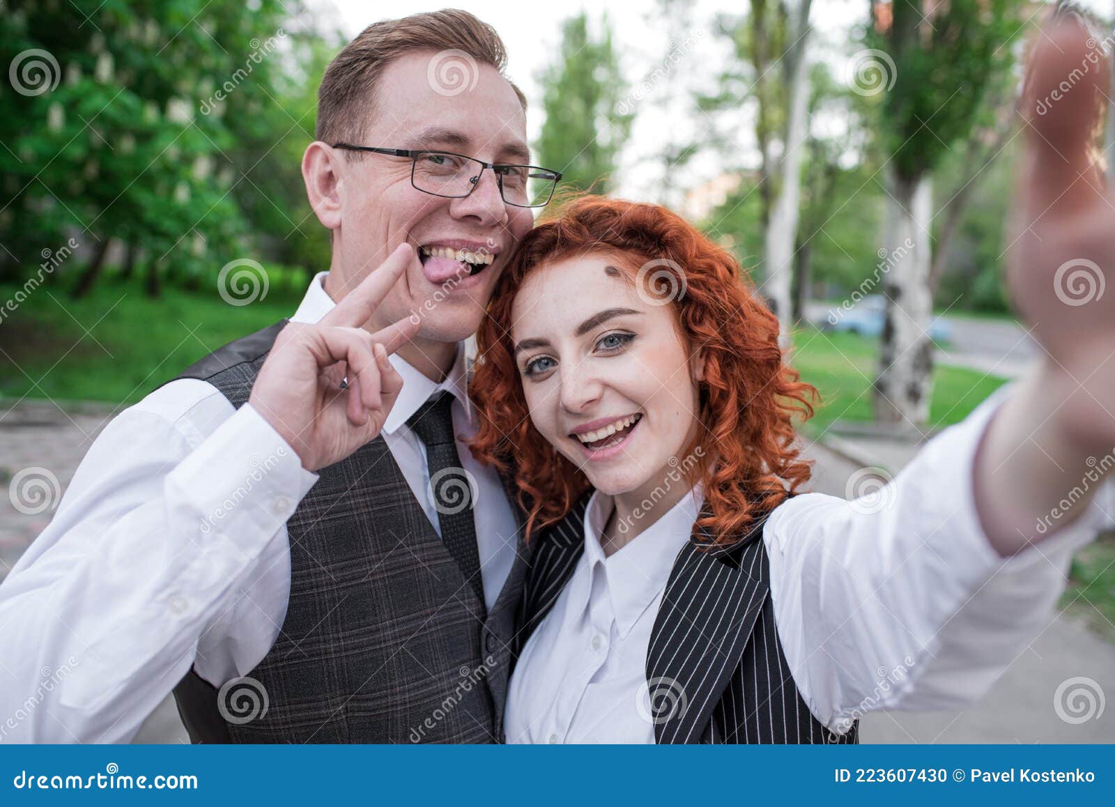 Husband and Wife Take a Selfie. Husband Shows Peace Gesture. Stock ...