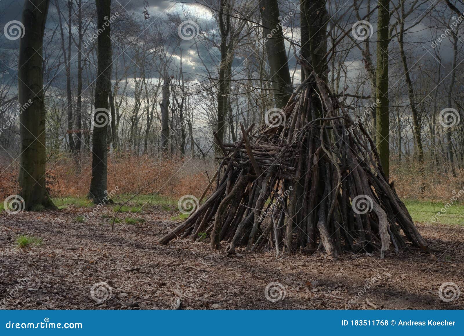 Stick Hut House in Forest. Dramatic Clouds in the Background Stock ...
