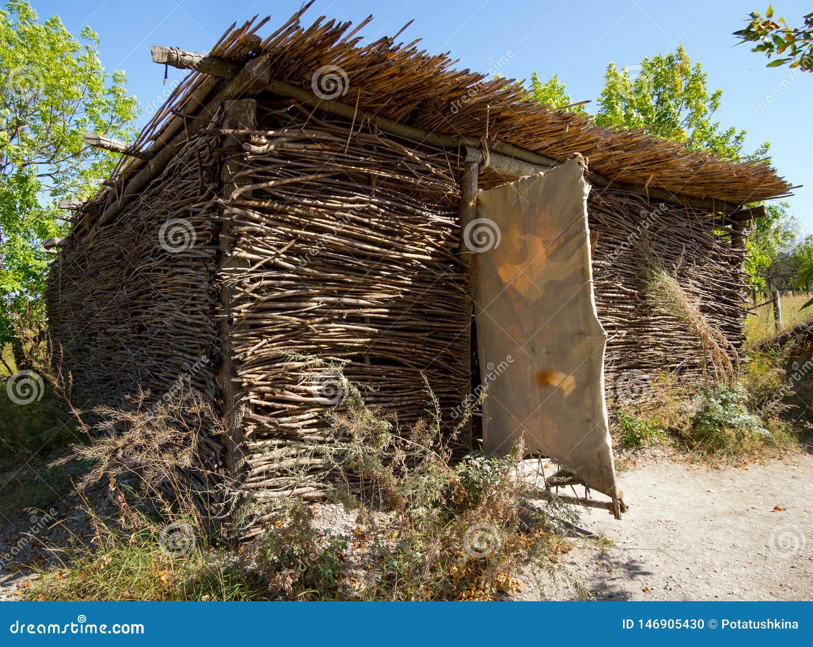 A Hut with Walls of Interlaced Twigs, Covered with Reeds Stock Photo ...