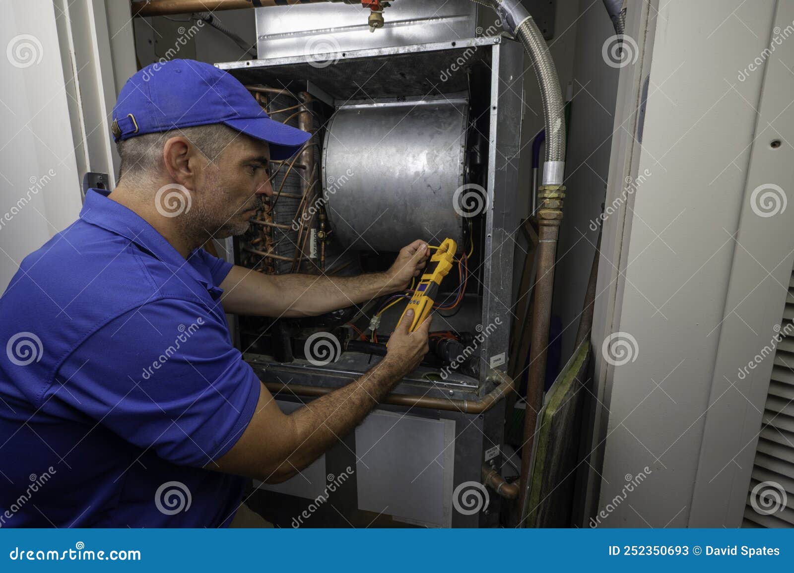 Hvac Technician Checking Current on a Motor Wire Stock Image - Image of ...