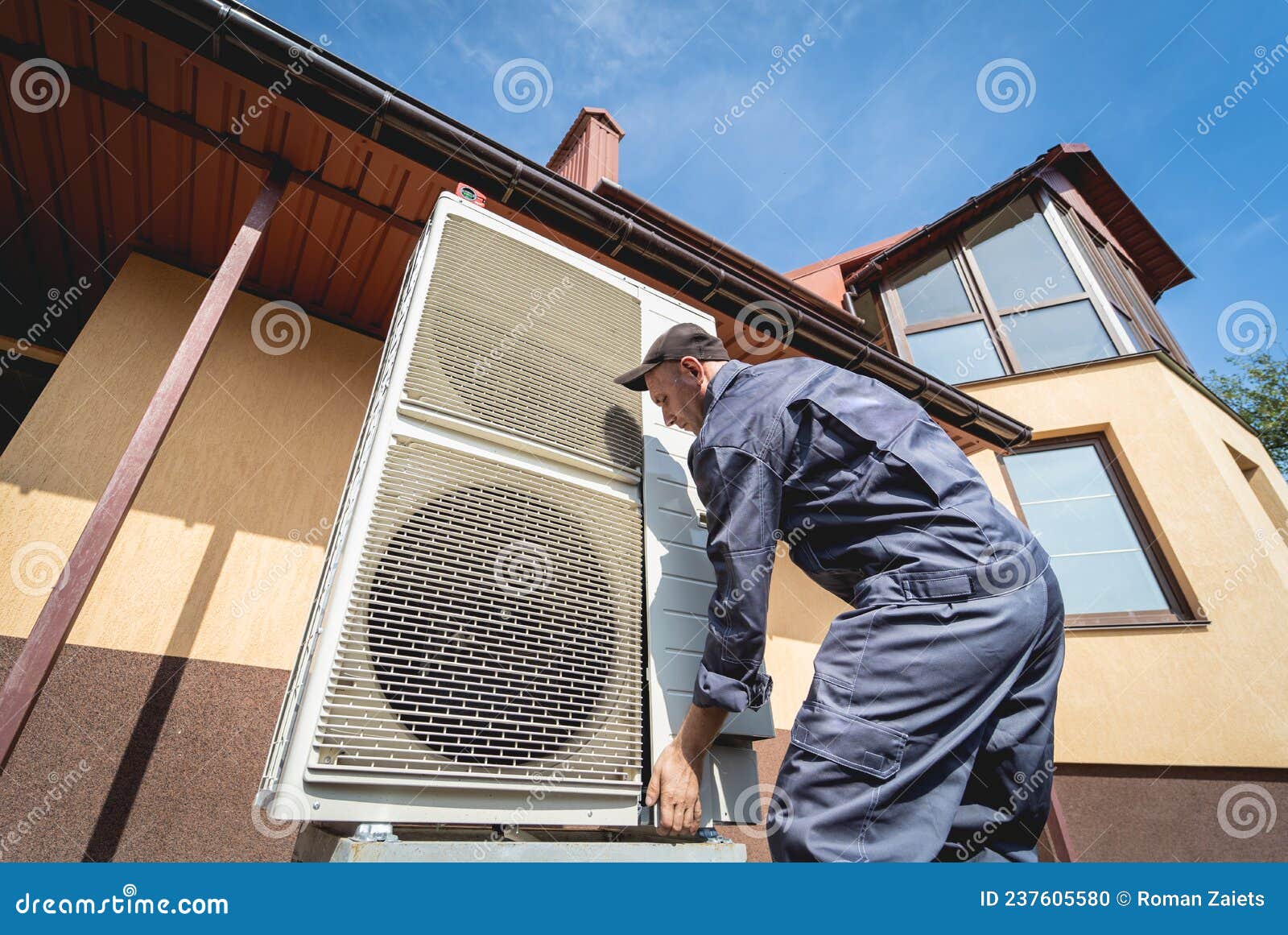 HVAC Technician Servicing Home Heating and Cooling System Stock Photo ...