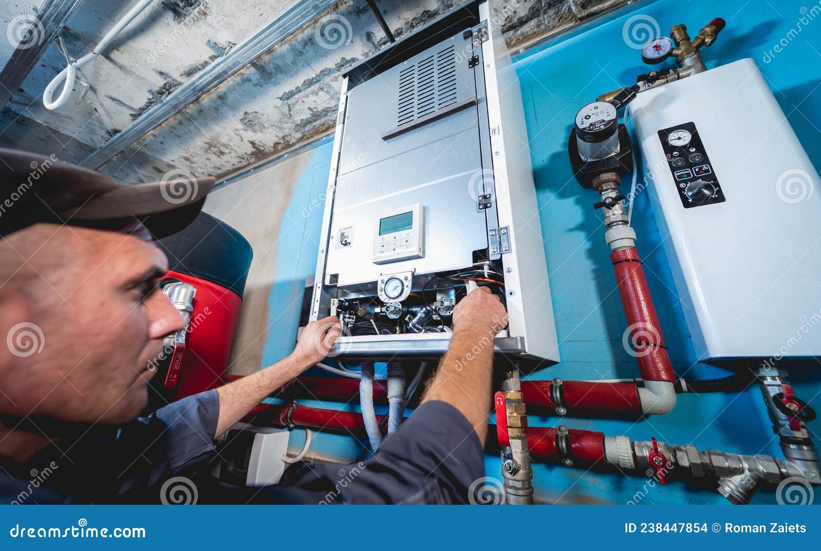 HVAC Technician Servicing Home Heating and Cooling System Stock Photo ...