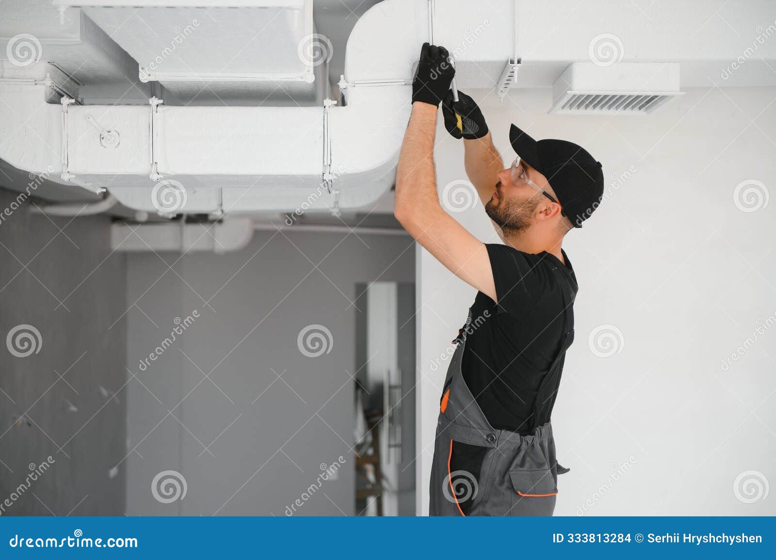 Hvac Technician at Work. Ventilation, Heating System Maintenance and ...