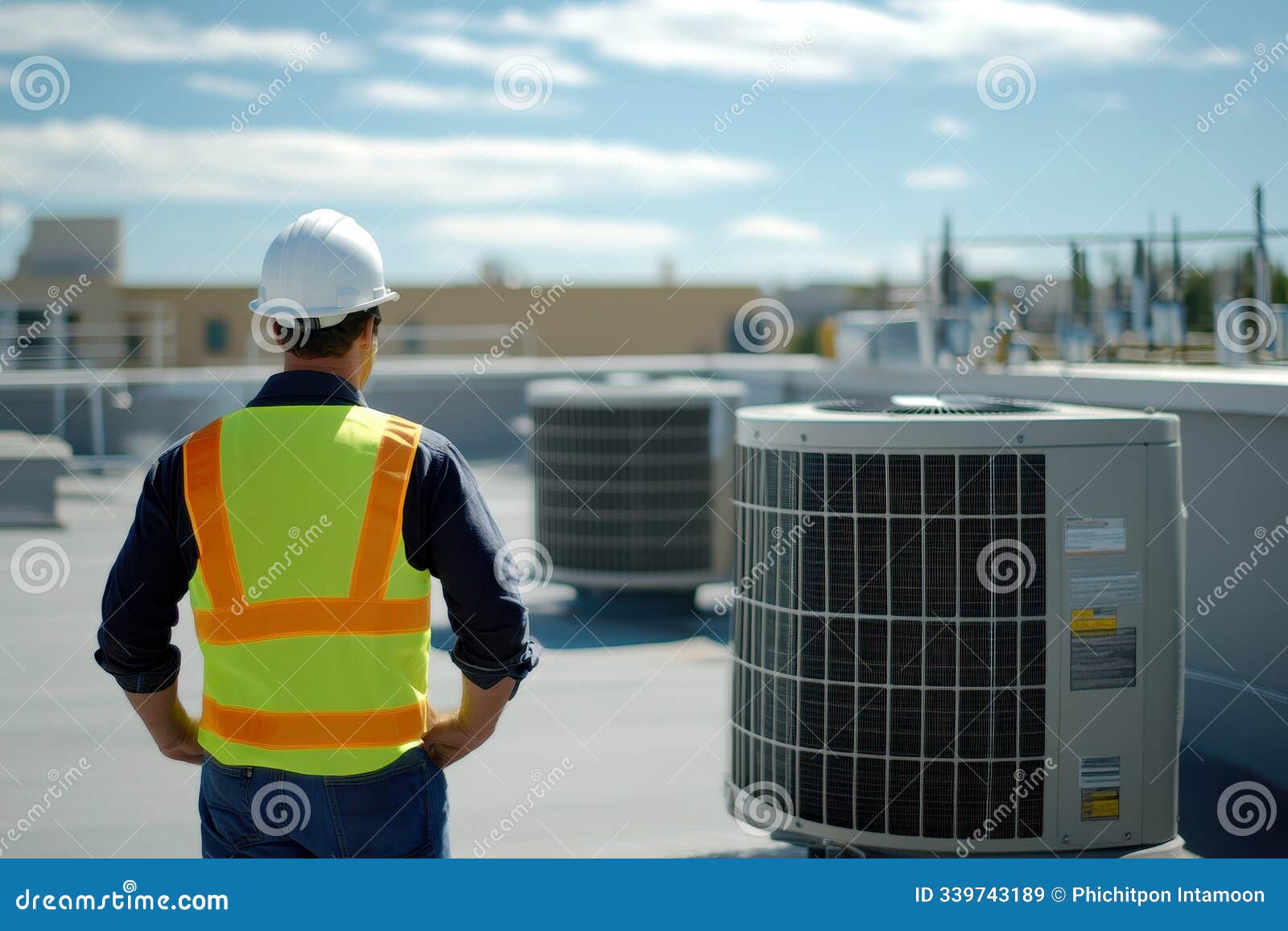 HVAC Technicians in Hard Hats and Reflective Vests Standing by Air ...