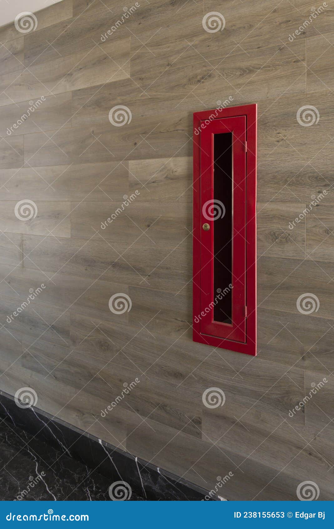Hydrant or Fire Outlet in Building Corridor on a Brown Marble Wall ...