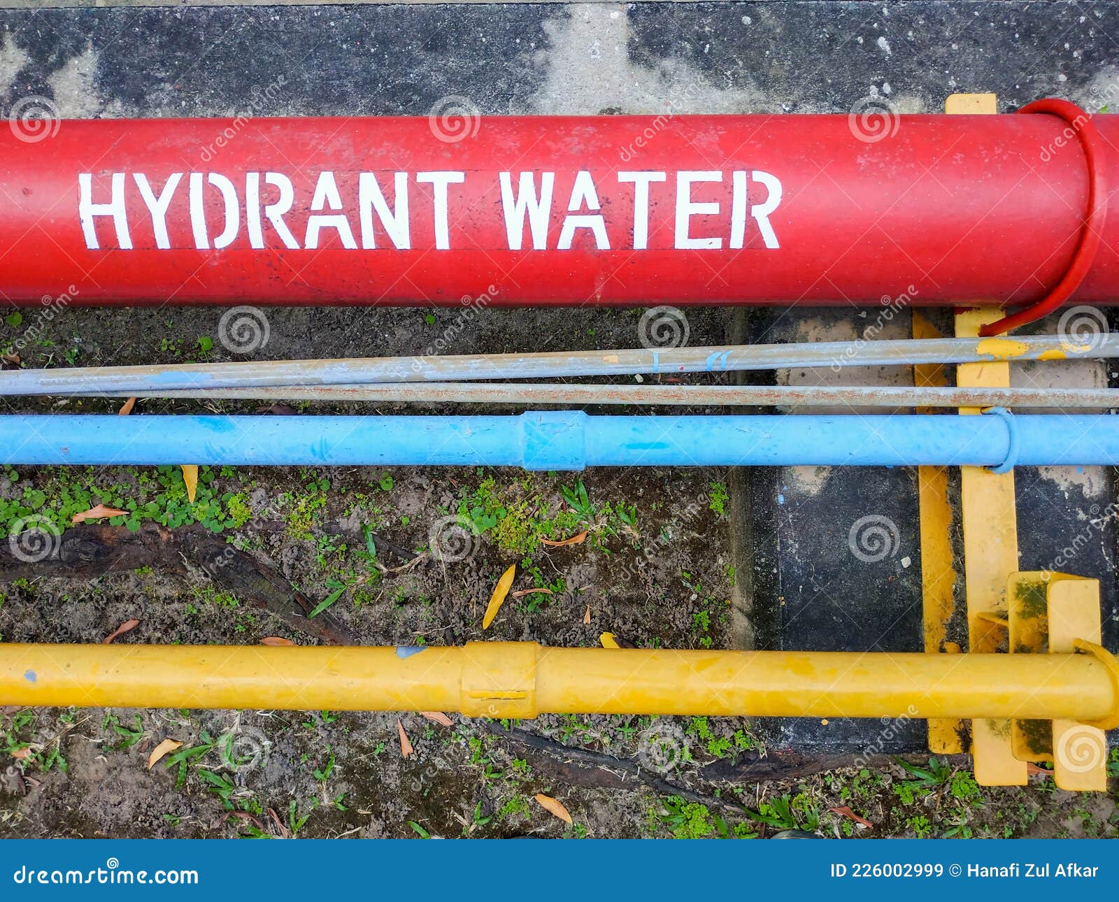 Hydrant Pipe Along with Two Other Pipes Crossing on the Ground. Stock ...