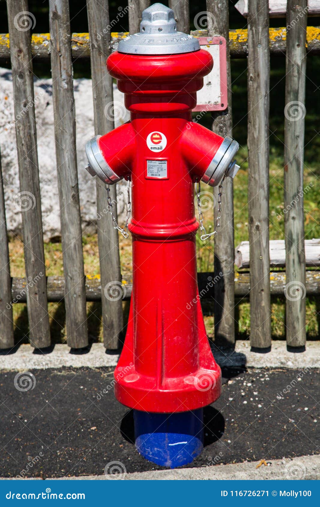 Hydrant, Red Hydrant in Front of Garden Fence Editorial Photo - Image ...