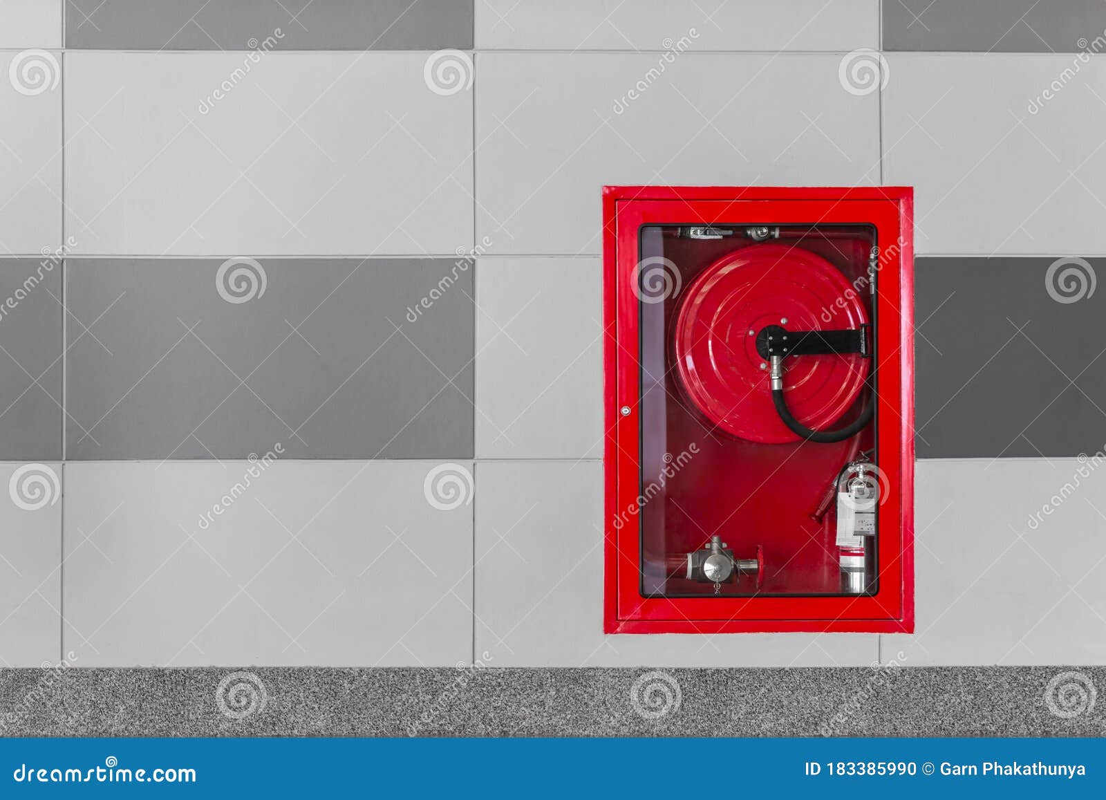 Hydrant with Water Hoses and Fire Extinguish Equipment on the Wall in ...