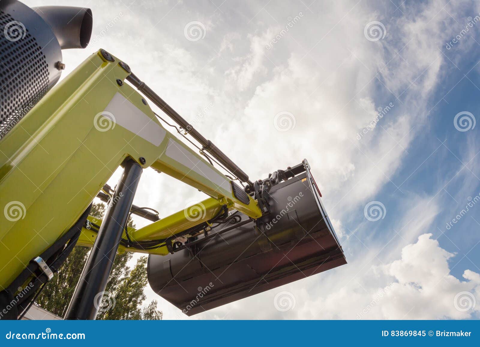 Hydraulic Buldozer Bucket at Construction Site Against Blue Sky Stock ...