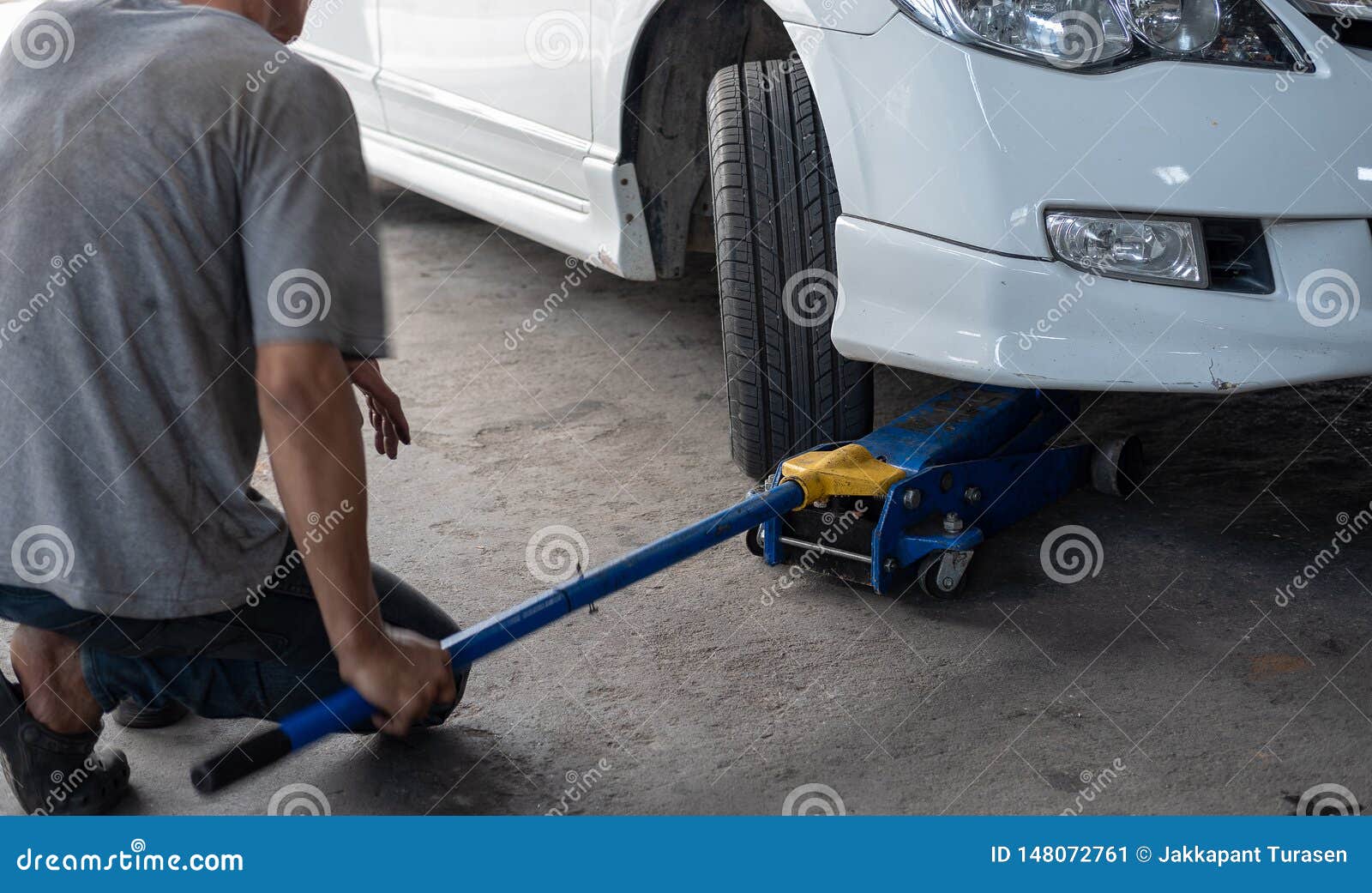 Hydraulic Car Jack To Lift Car for Check the Wheel Stock Image - Image ...