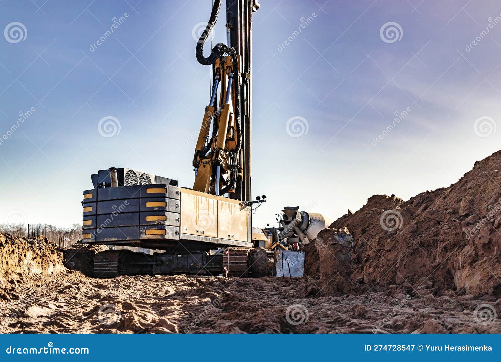 Hydraulic Drilling Machine in Excavation at the Construction Site ...