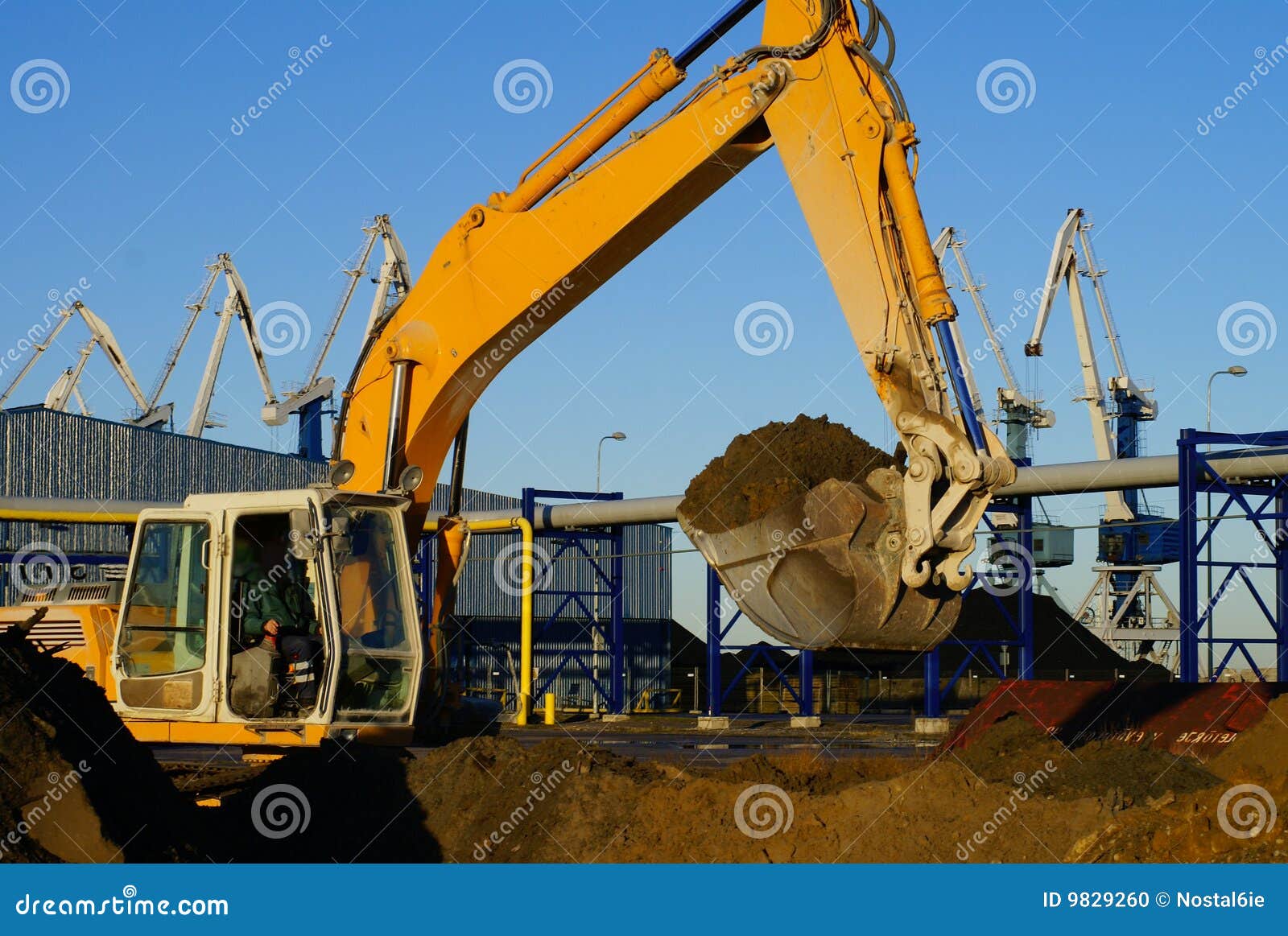 Hydraulic Excavator at Work Stock Photo - Image of backhoe, lifted: 9829260