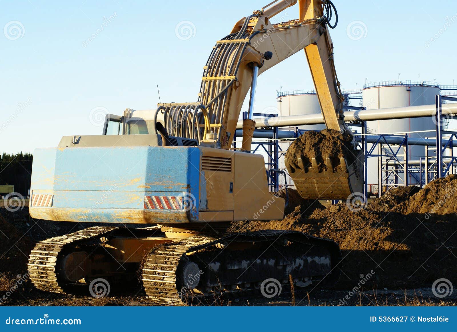Hydraulic Excavator at Work Against Blue Sky Stock Image - Image of ...