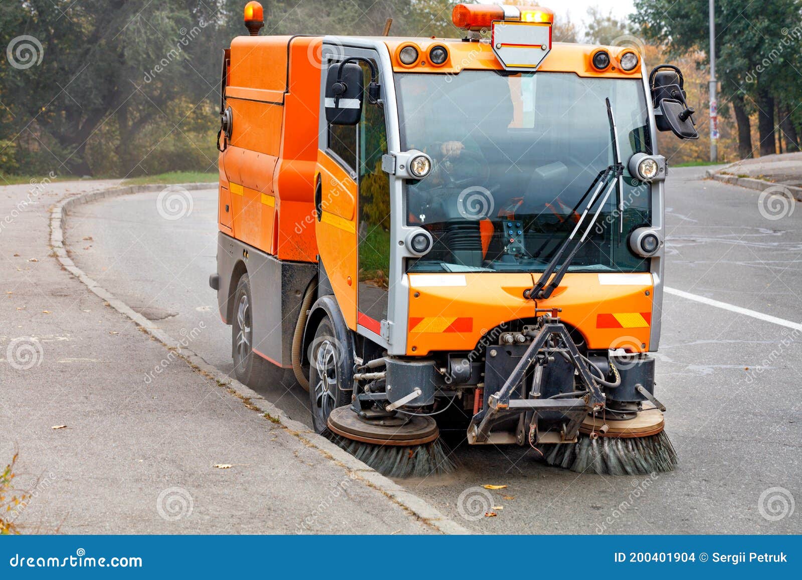 A Hydraulically Powered Road Sweeper Sweeps the Street Stock Photo ...