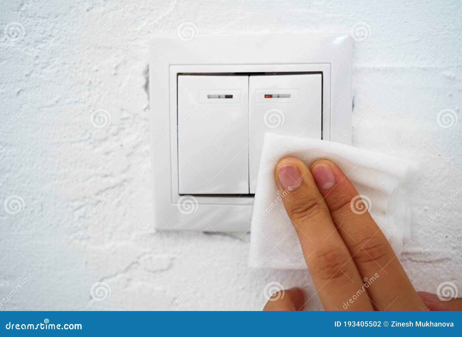 Hygiene Rules Wiping the Light Switch with a Cloth with a Disinfectant ...