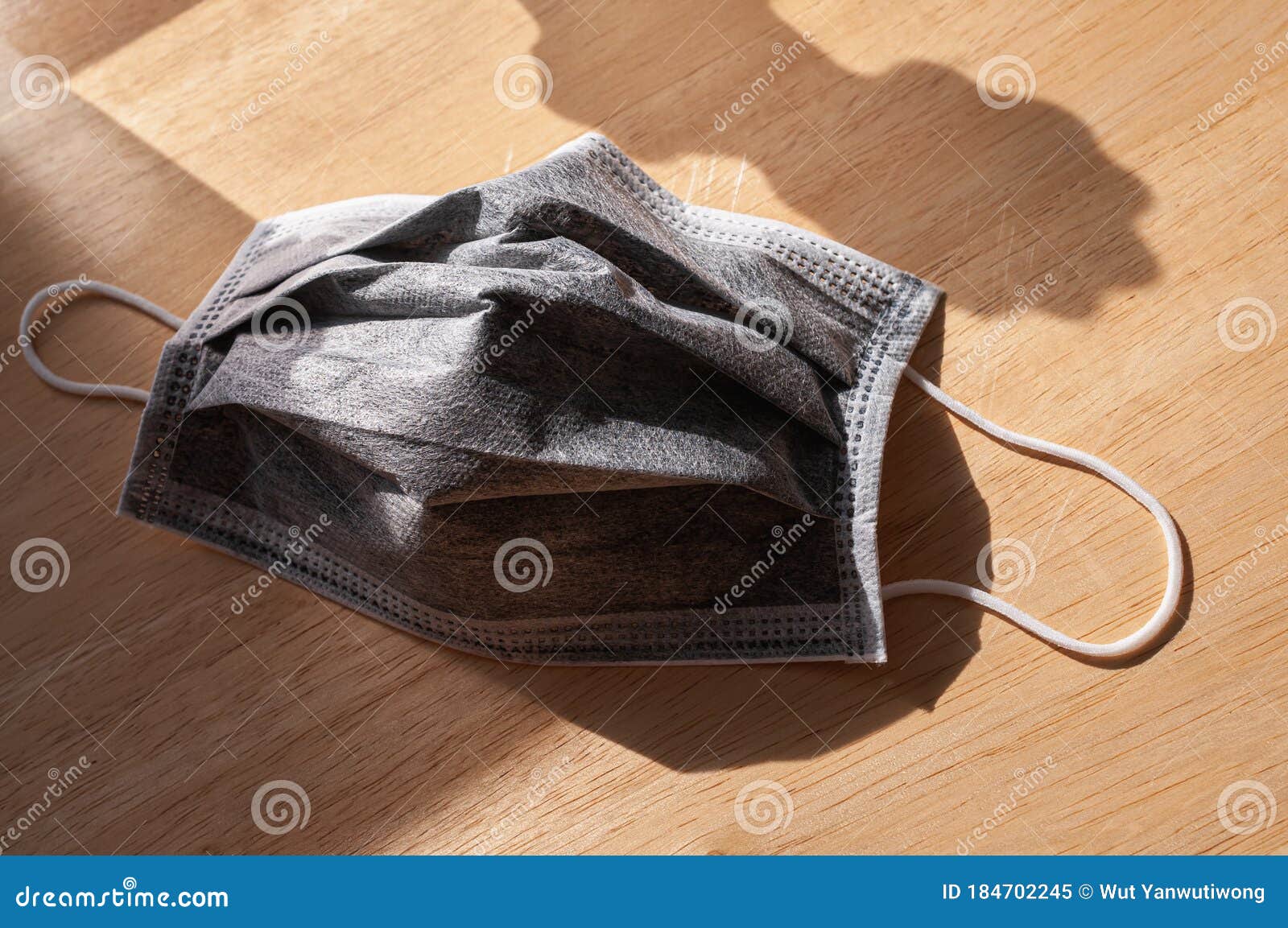 Hygienic Face Mask on the Table in a Shadow of Sunlight Stock Image ...