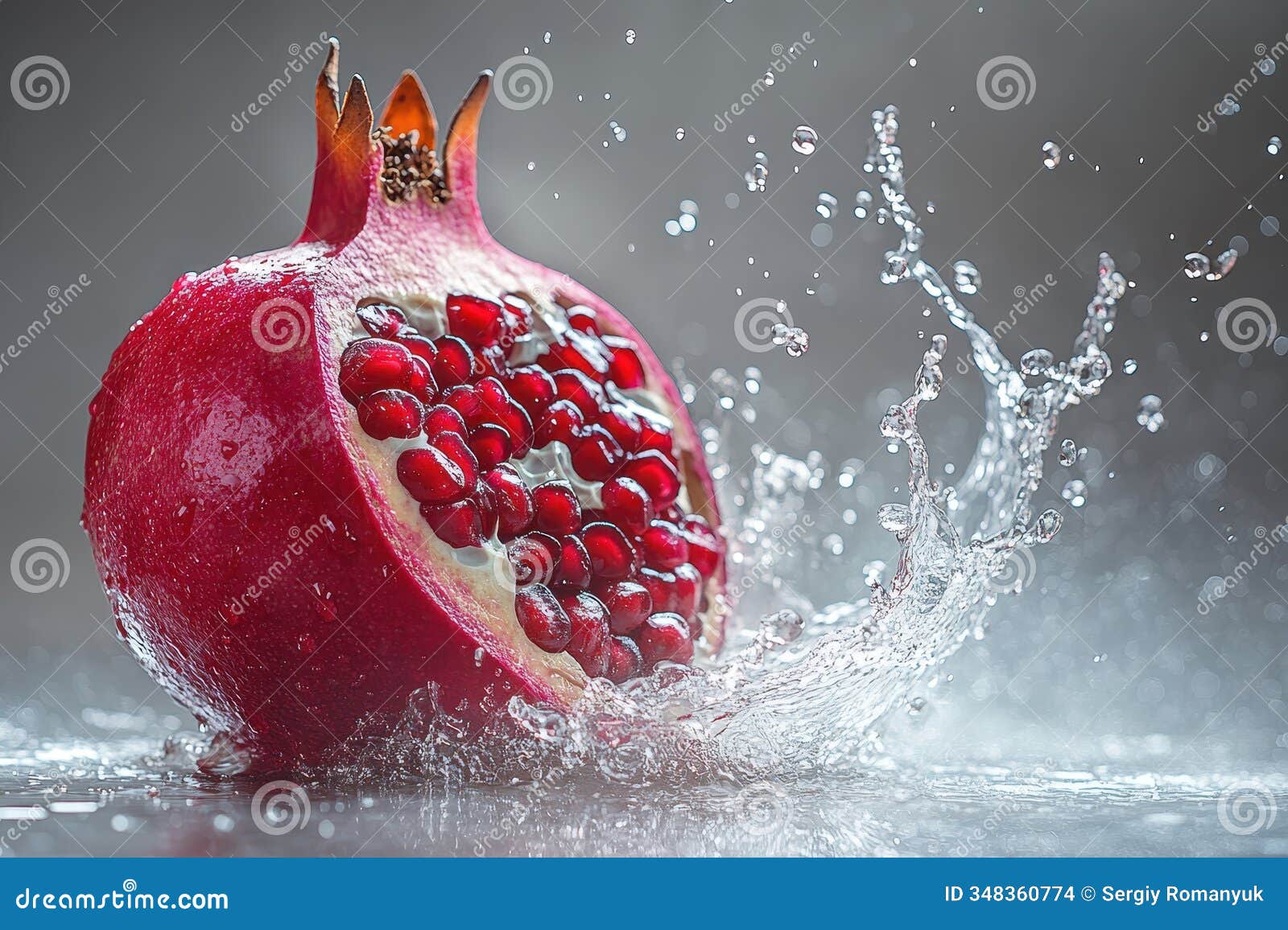 Smashed Pomegranate Bursting with Juice and Seeds Scattering on the ...