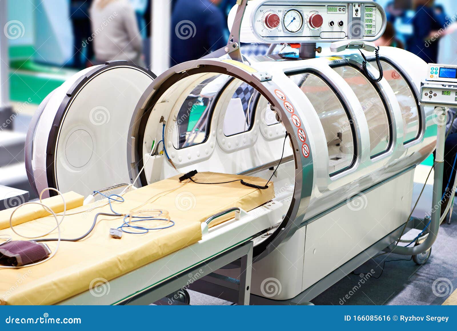 A Hyperbaric Chamber With A Man Lying Inside. Treatment In An Oxygen ...