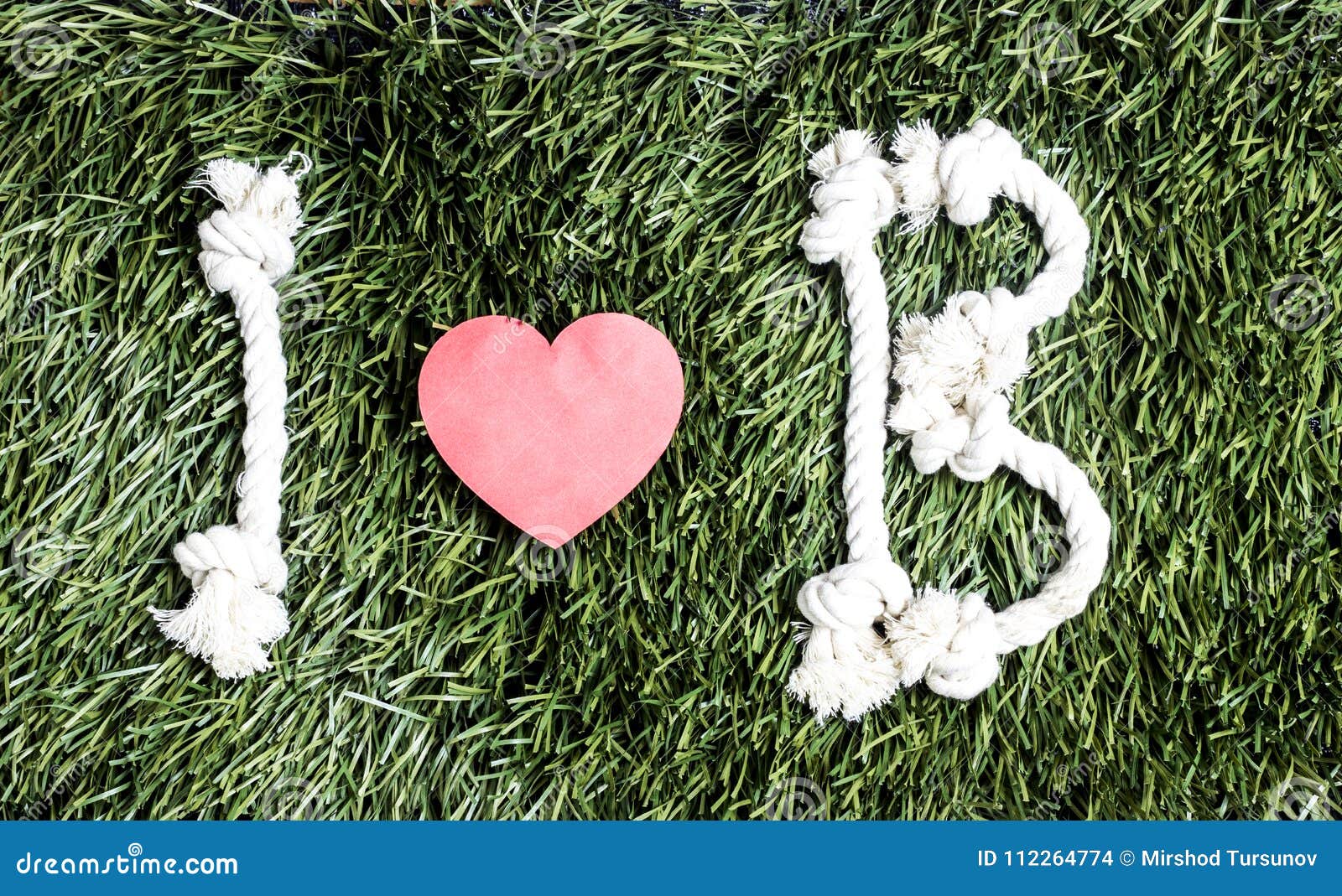 I and B Letters and Three Paper Heart Cut Outs on Grass. Stock Photo ...