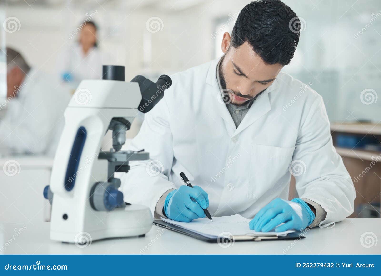 I Better Record that. a Young Scientist Writing Notes while Using a ...