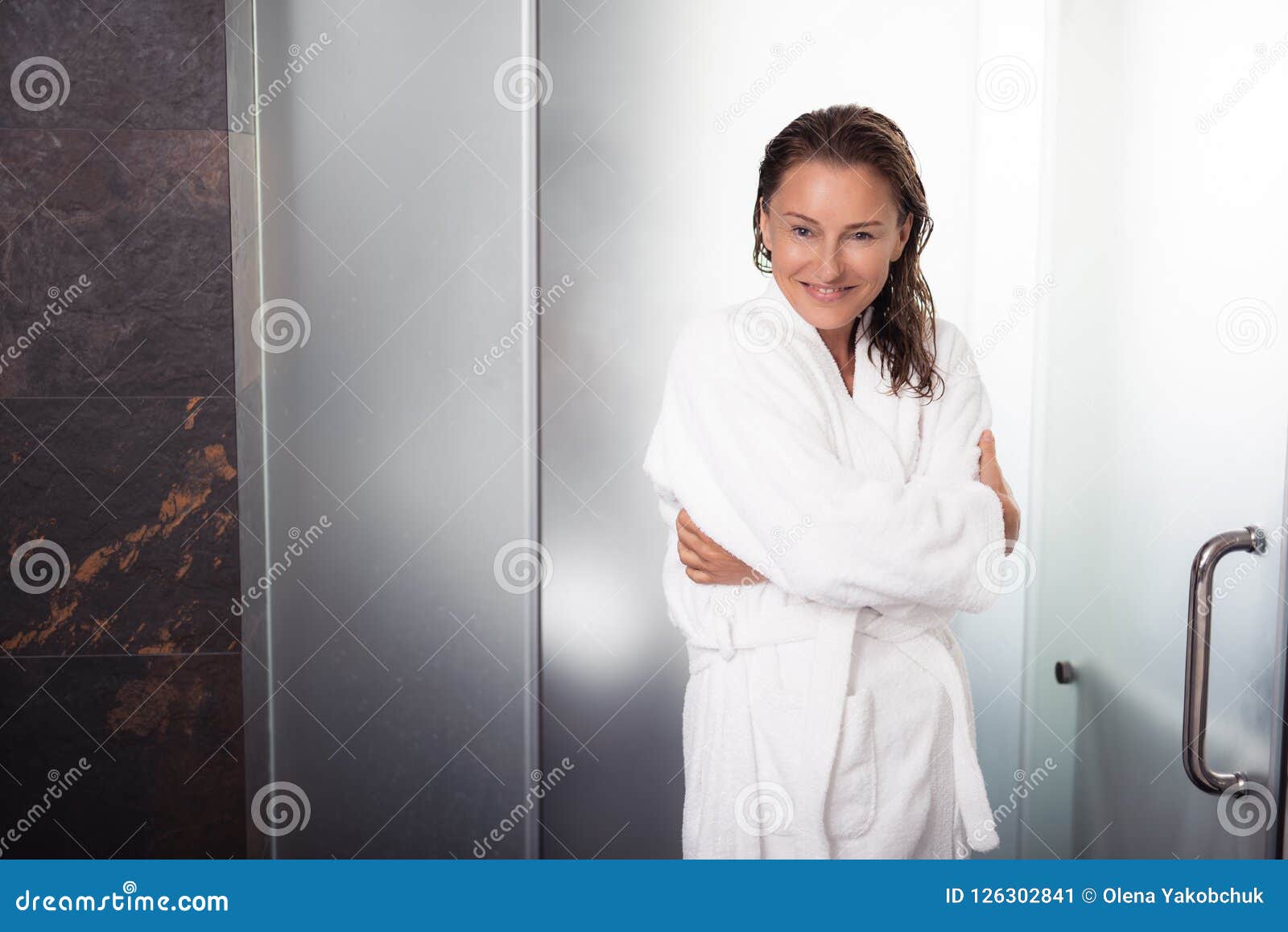 Beautiful Middle Aged Lady Standing Near Bathroom After Taking Shower