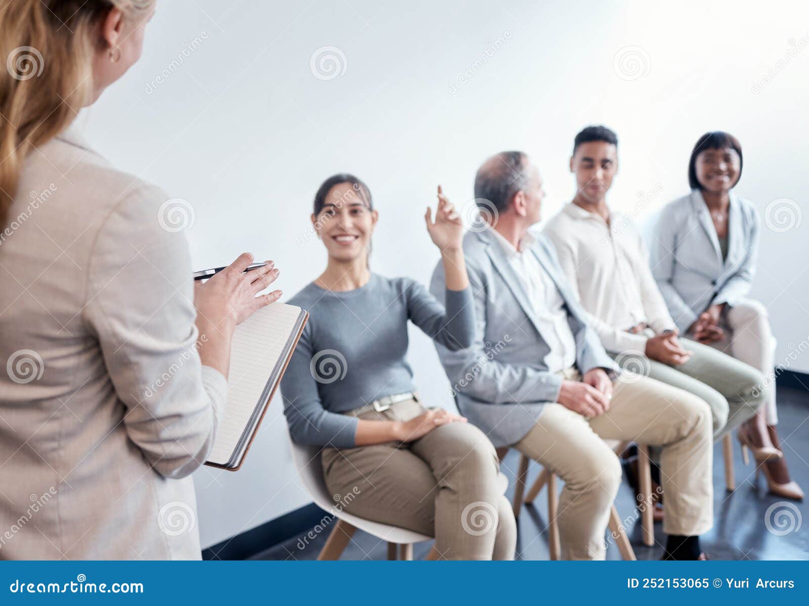 I Have Another Question. a Group of New Employees Having a Discussion ...