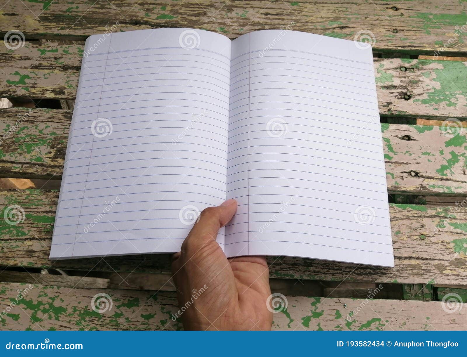 I Hold a Notebook and Open the Pages of the Blank Notebook Stock Photo ...
