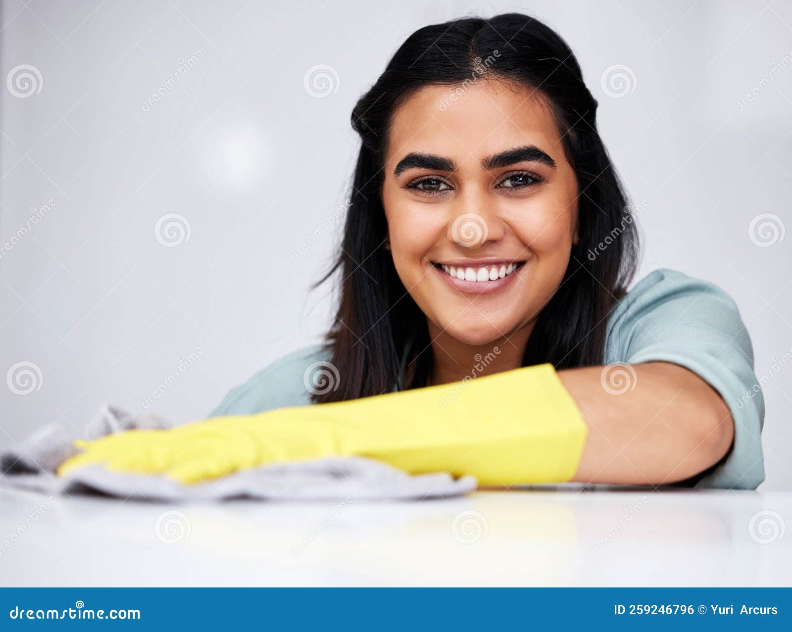 I Keep All Surfaces Clean at All Times. a Woman Using a Cloth while ... I Keep All Surfaces Clean at All Times. a Woman Using a Cloth while ...