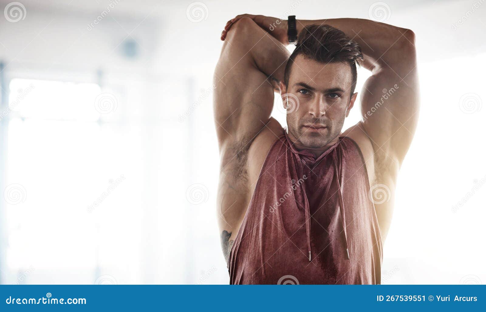 Before I Lift I Stretch. a Handsome Young Man Stretching at the Gym ...