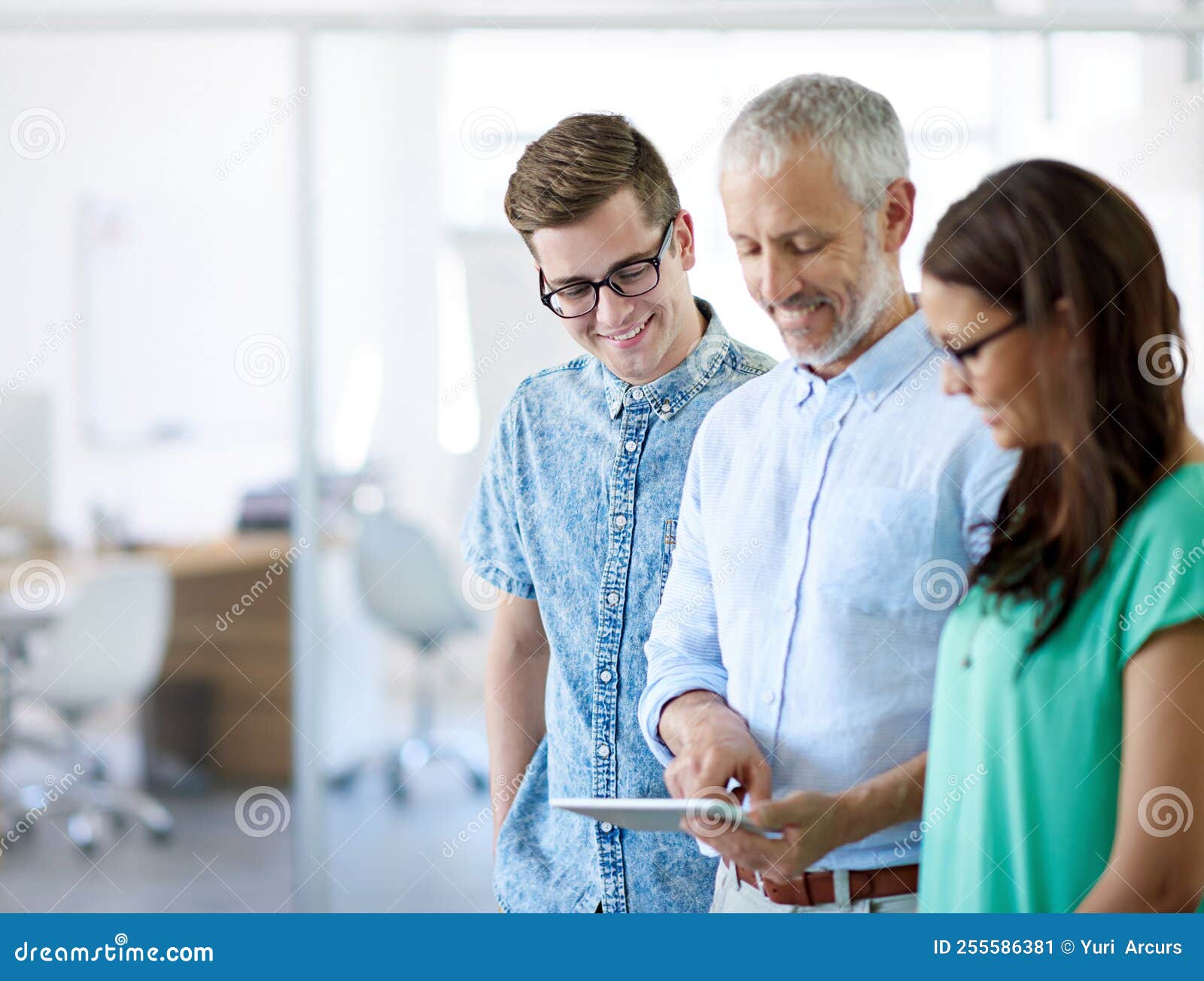I Like this. a Group of Creative Businesspeople Looking at a Tablet ...