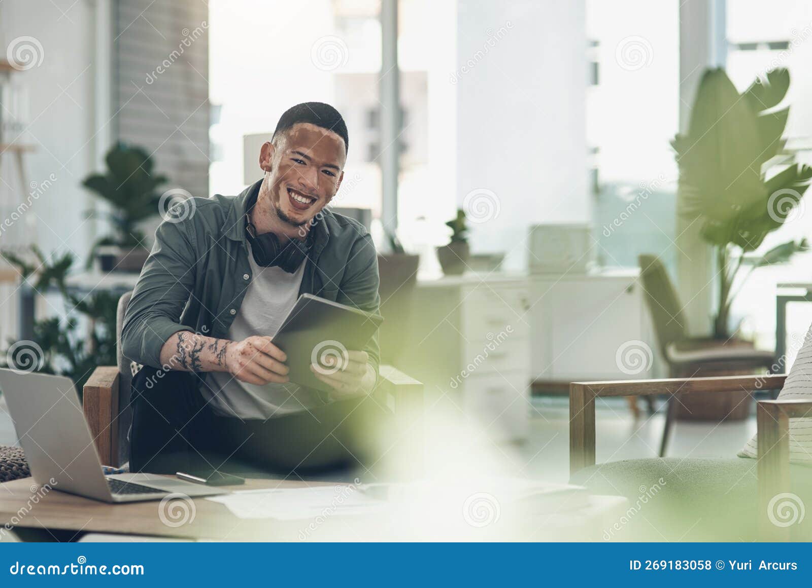 I Love To Wake Up and Work. a Young Business Man Using a Tablet at Work ...