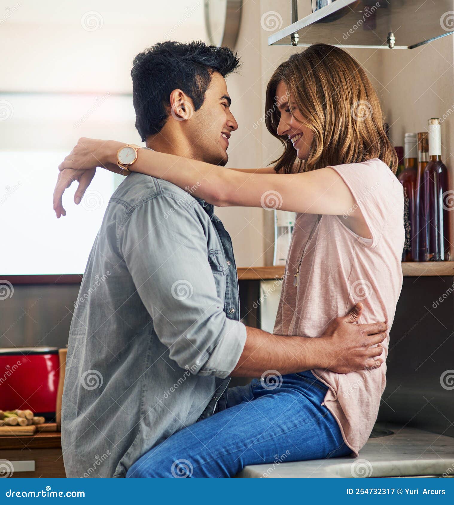 I Love You. an Affectionate Young Couple Arm in Arm in the Kitchen ...