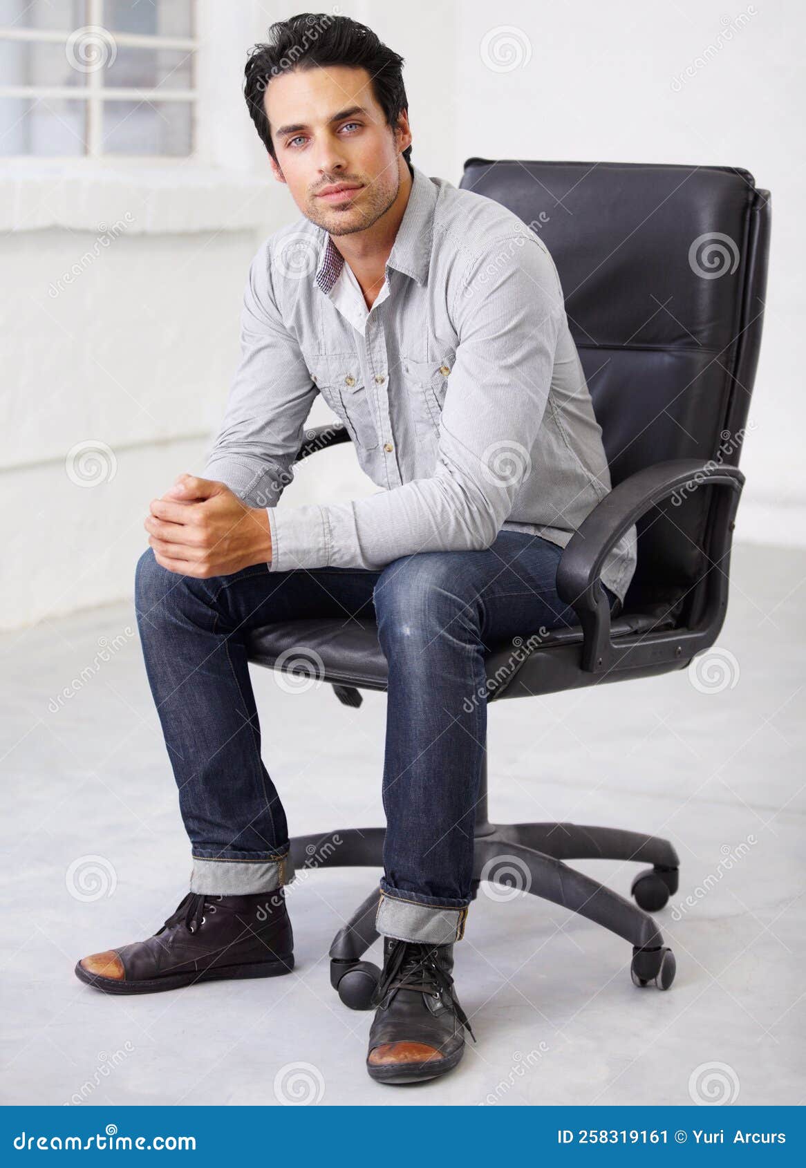 I Man of Substance. a Handsome Young Sitting in a Chair. Stock Image ...