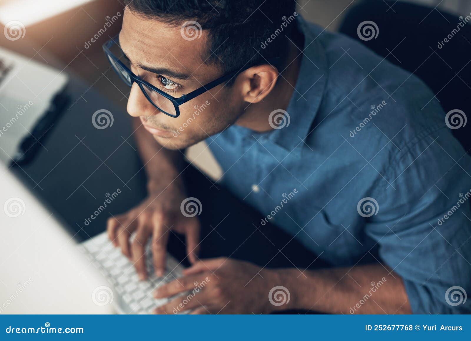 I Might Bend a Little but I Dont Fold. a Young Using a Computer in a ...