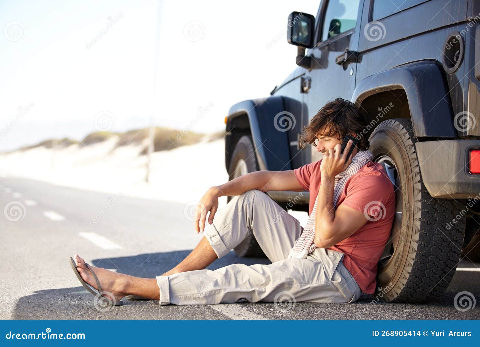 I Need a Little Help Out Here. a Young Man Phoning for Roadside ...