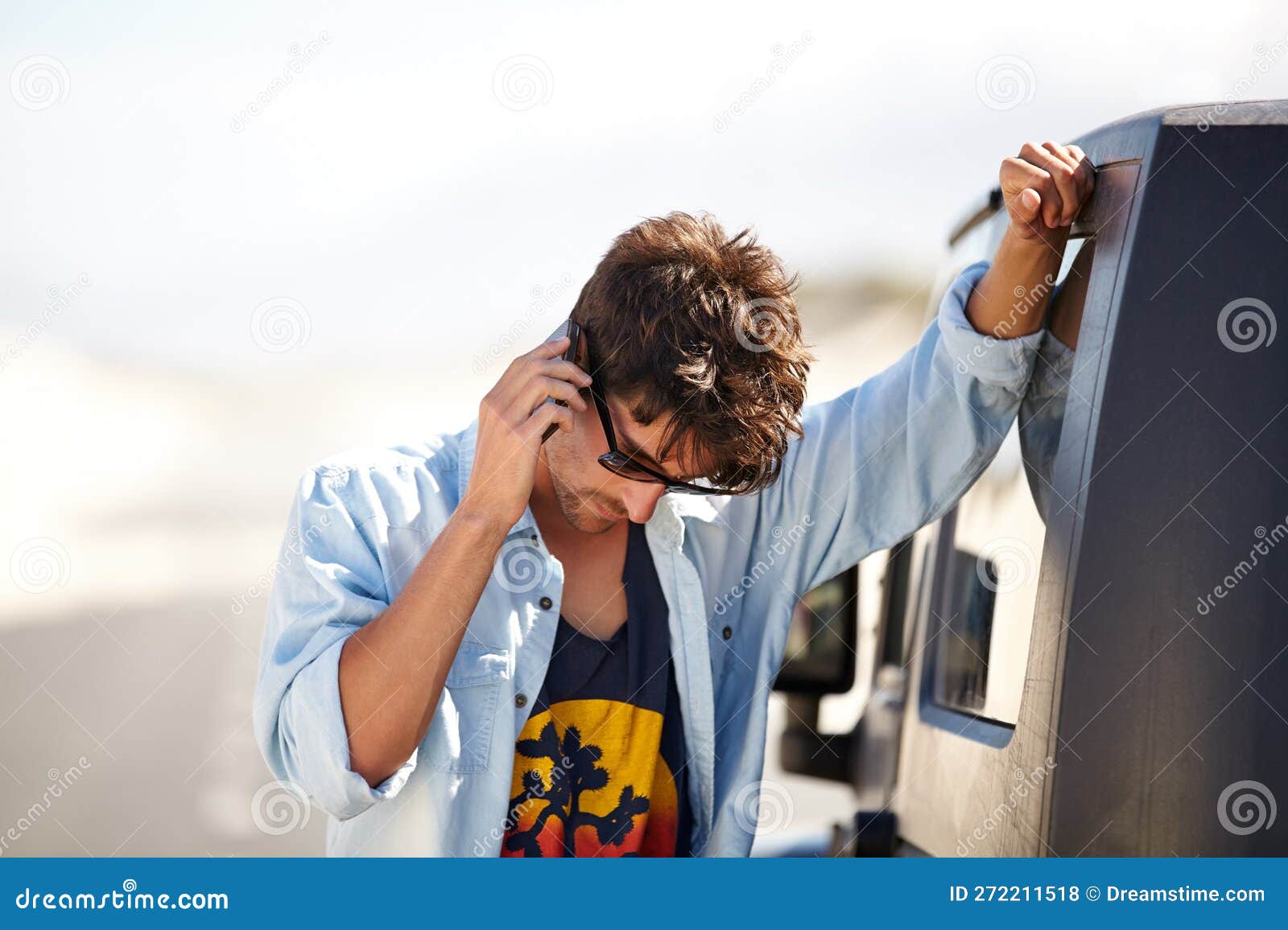 I Need a Little Help Out Here. a Young Man Phoning for Roadside ...