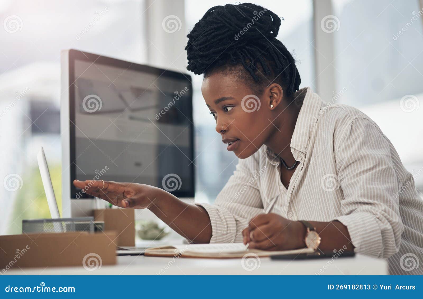 I Plan on Having a Productive Work Day. a Young Businesswoman Using Her ...