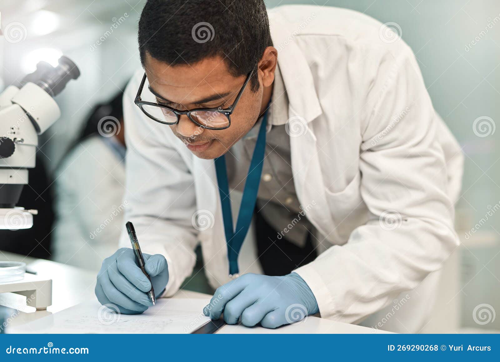 I Should Note that Down. a Young Scientist Writing Notes while Working ...