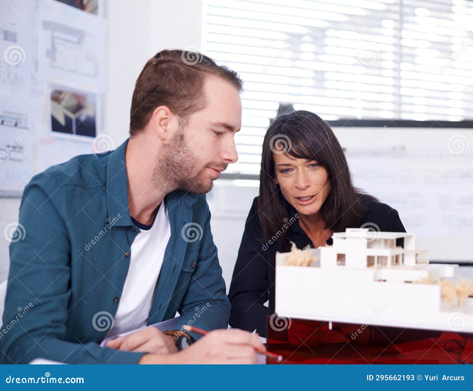I Think it Looks Great. Two Architects in Working on a Model of a House ...