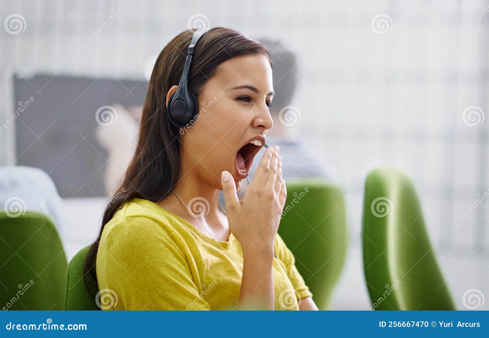 I Think I Need a Coffee Break. an Attractive Young Female Yawning at ...