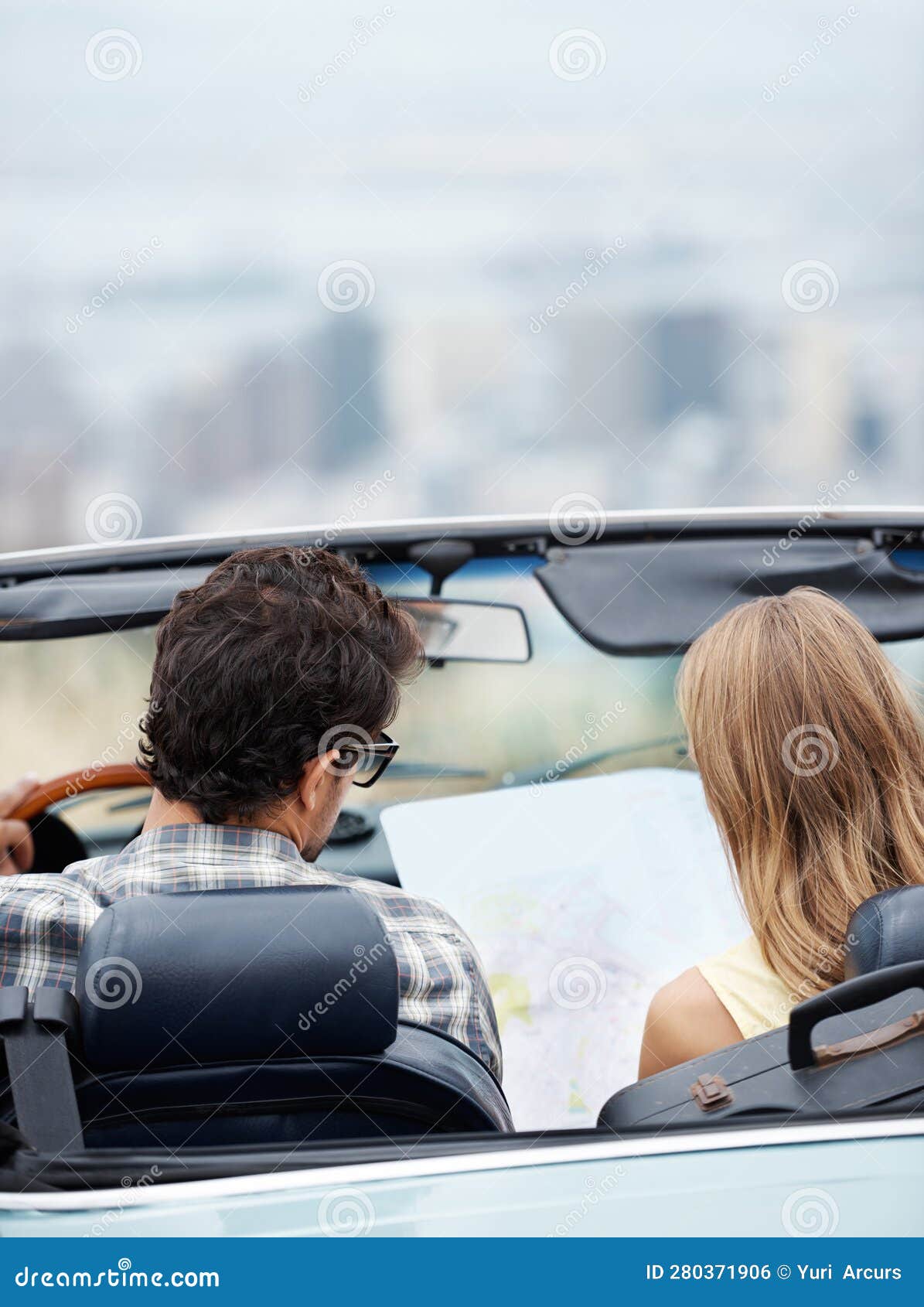 I Think we Should Go this Way Next...Rear View of a Young Couple in ...