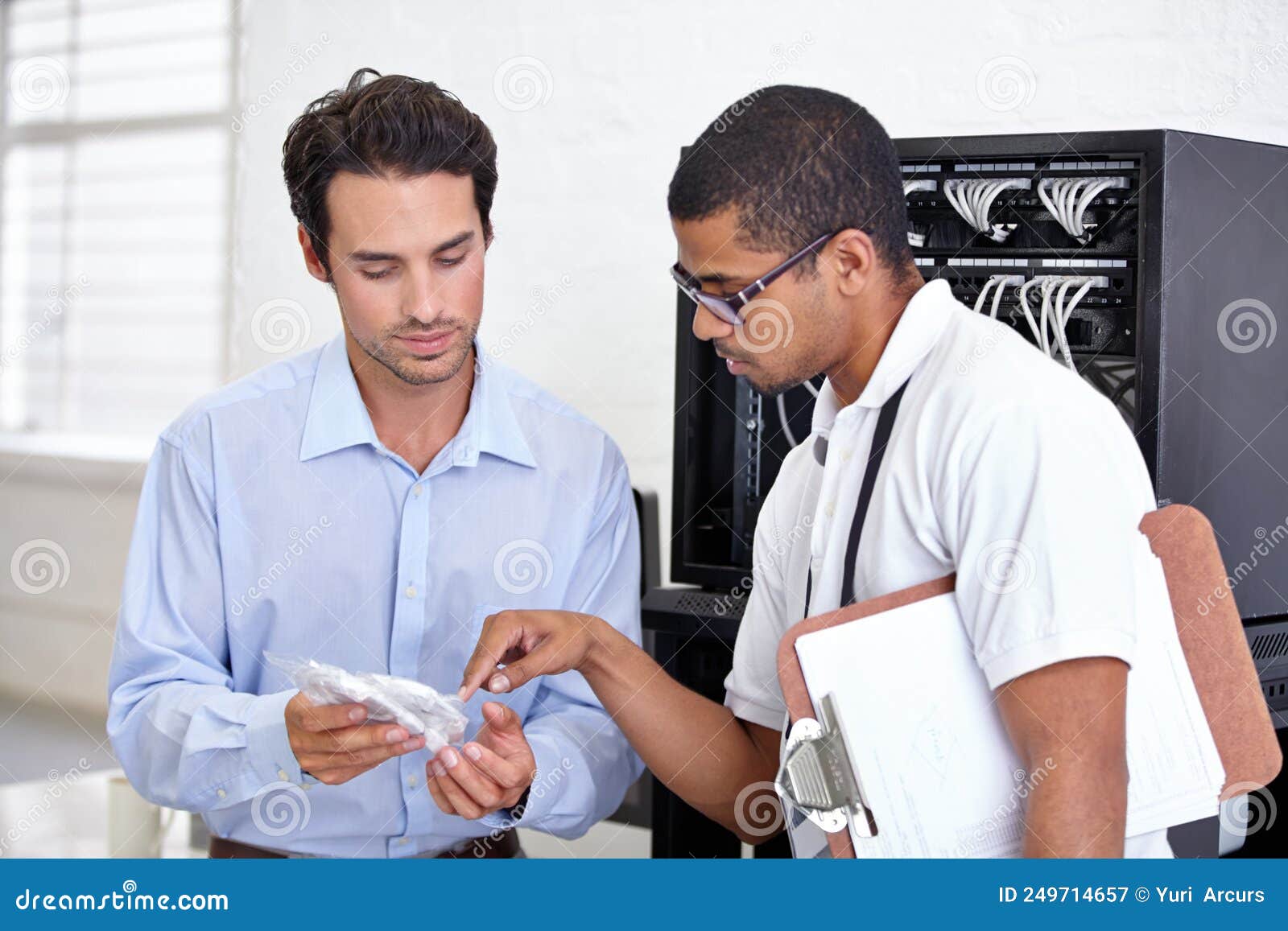 I Will Take this Wire. Two Men Looking at a Wire for the Computer ...